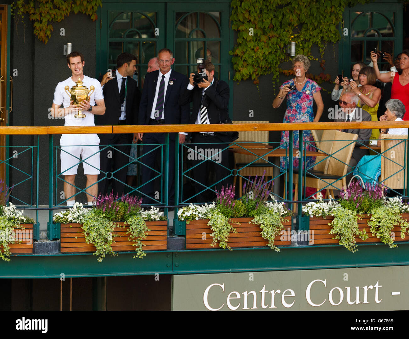 Great Britain's Andy Murray celebrates with the trophy on the balcony ...