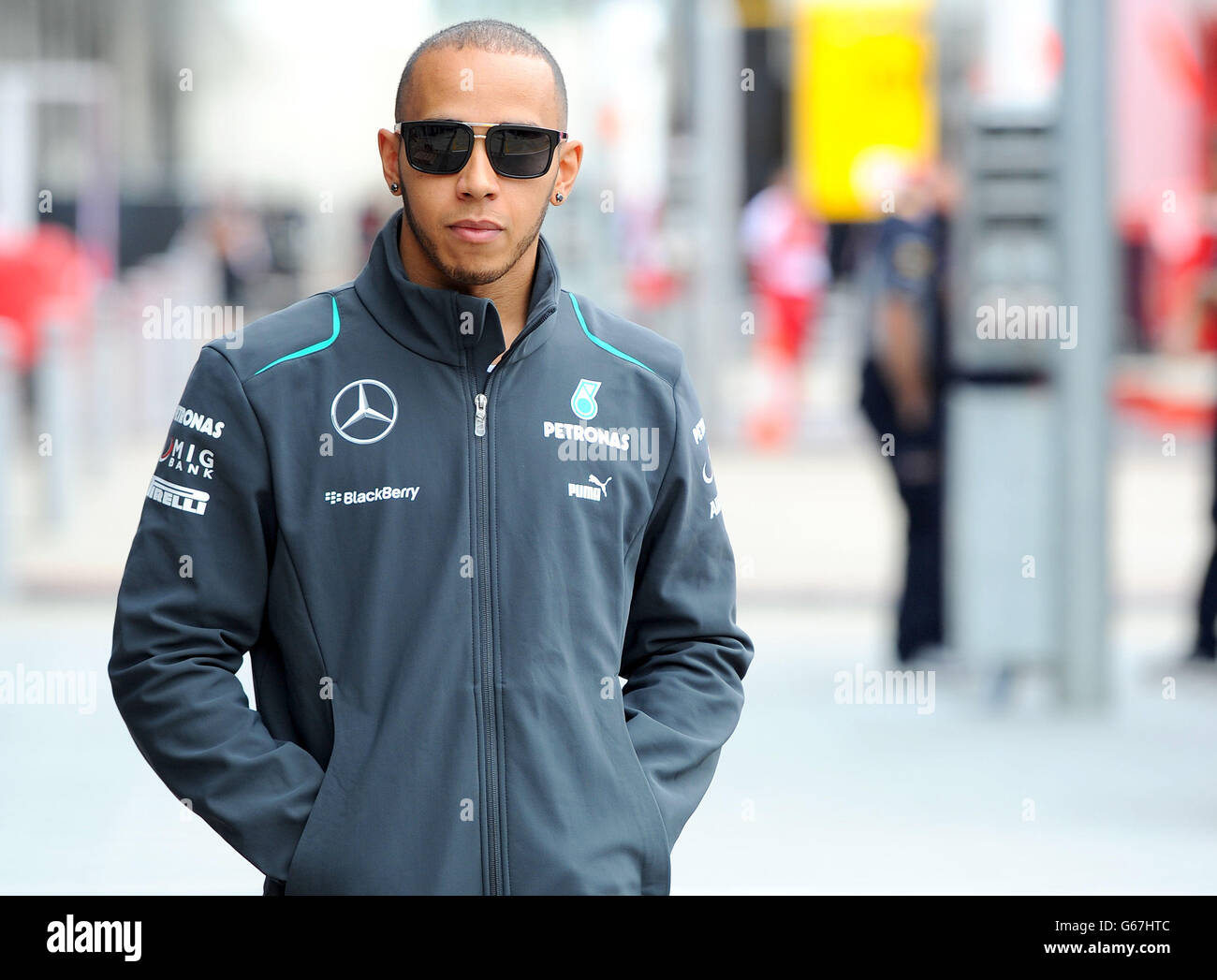 Mercedes driver Lewis Hamilton walks through the paddock during the ...