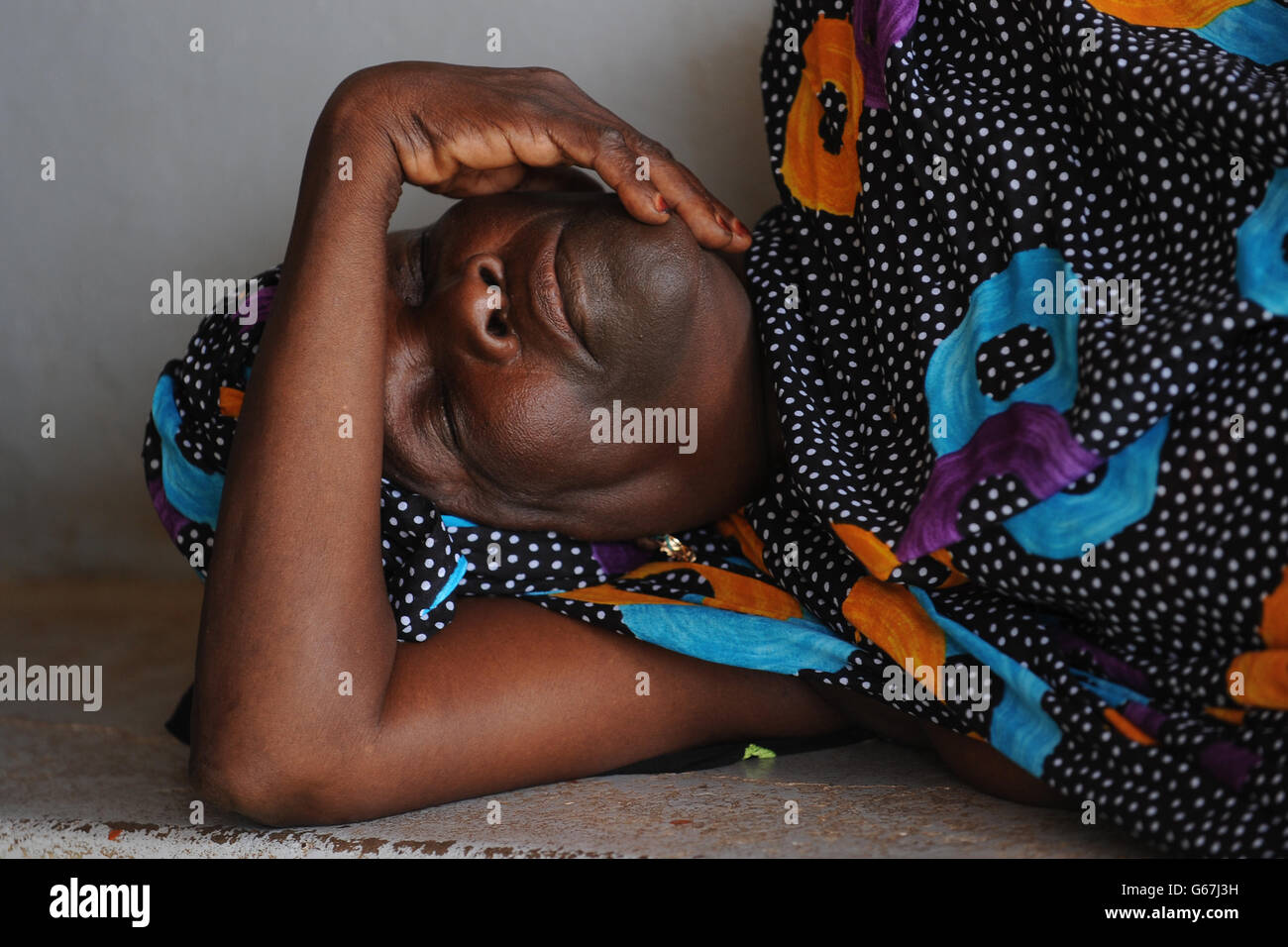 A women waits to be seen by a doctor at Mbour Hospital, Senegal. PRESS ...