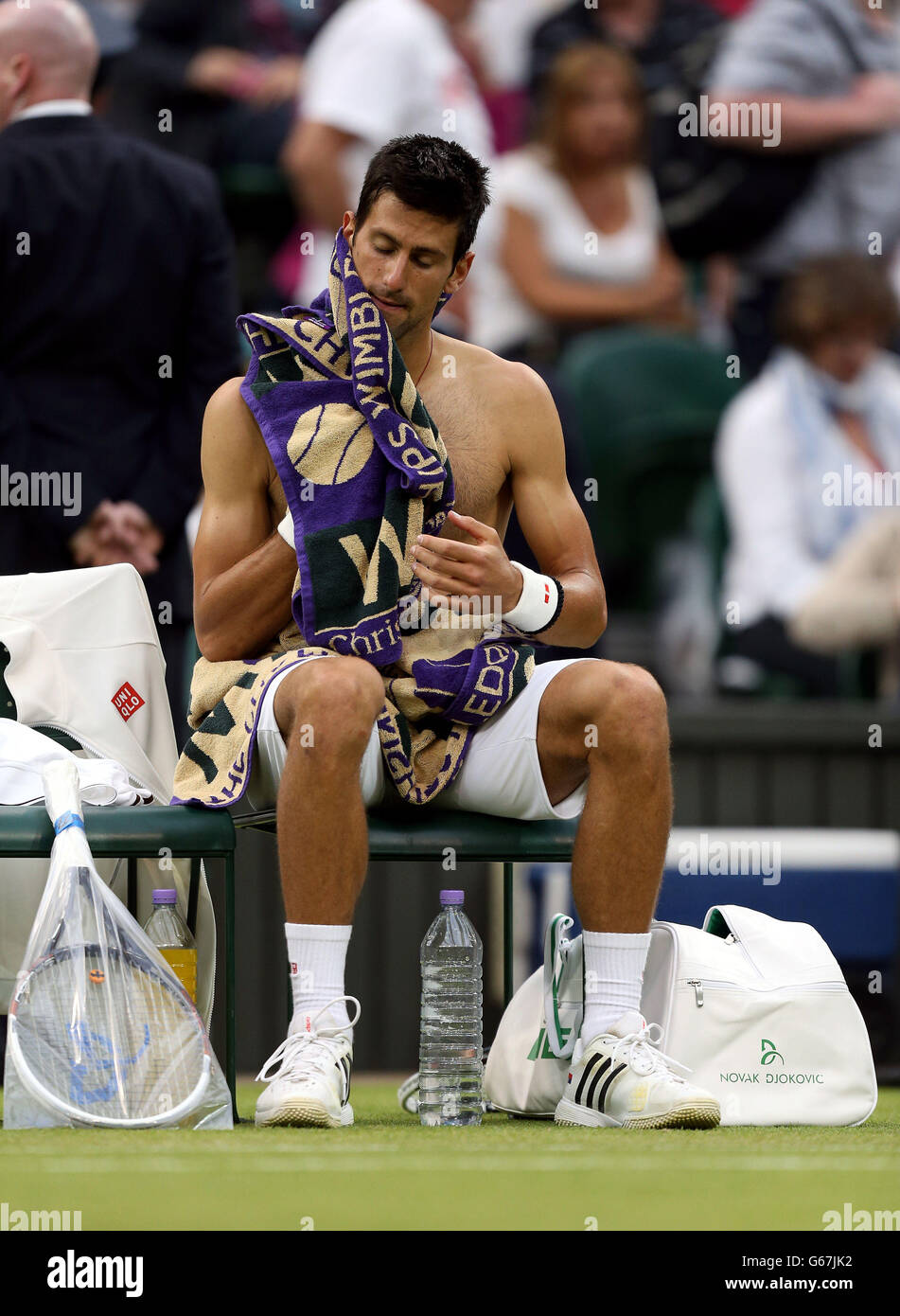 Serbia's Novak Djokovic changing his shirt and towels off during his ...