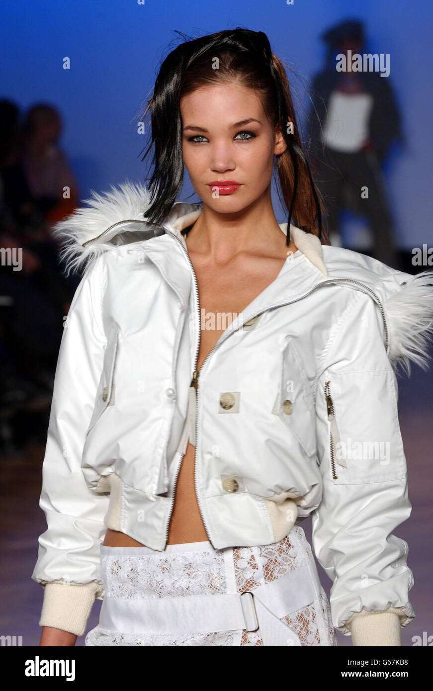 A model wears a creation by designers Fake London on the catwalk during ...