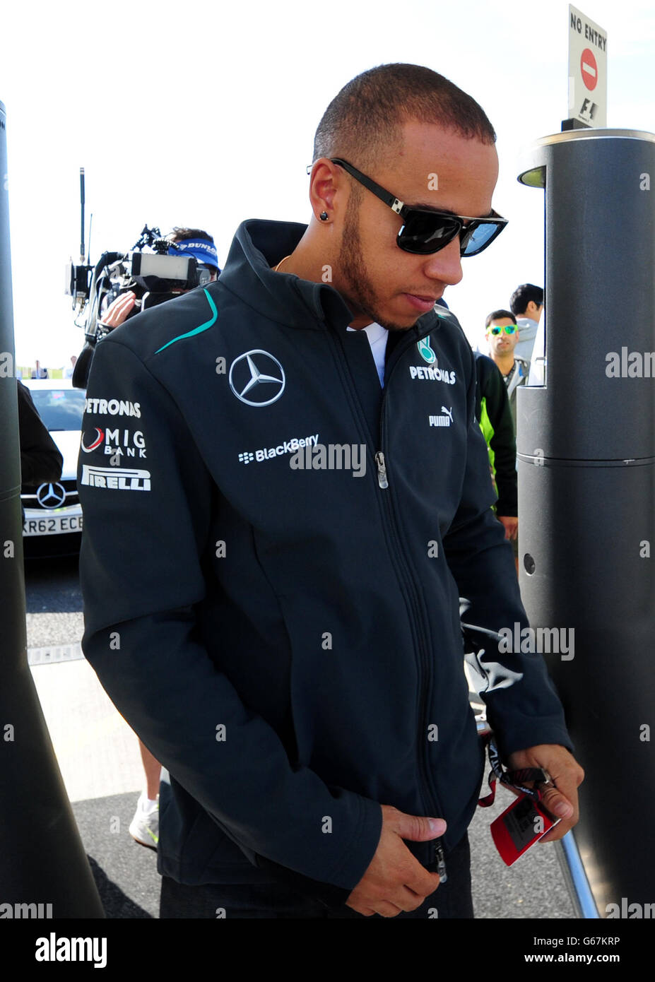 Mercedes' Lewis Hamilton arrives at the track for the 2013 Santander ...
