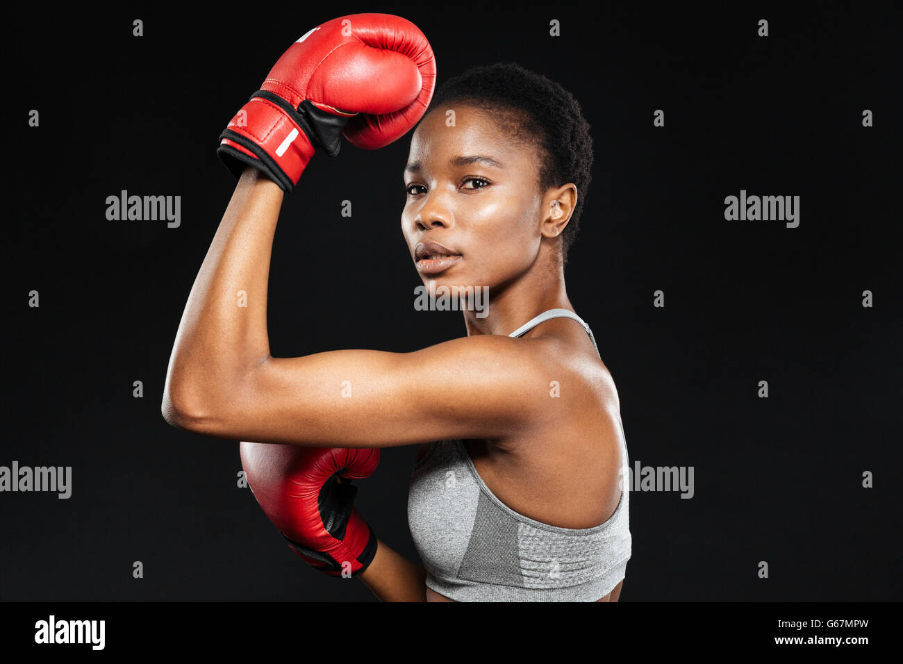 Woman in boxing gloves posing hi-res stock photography and images - Alamy