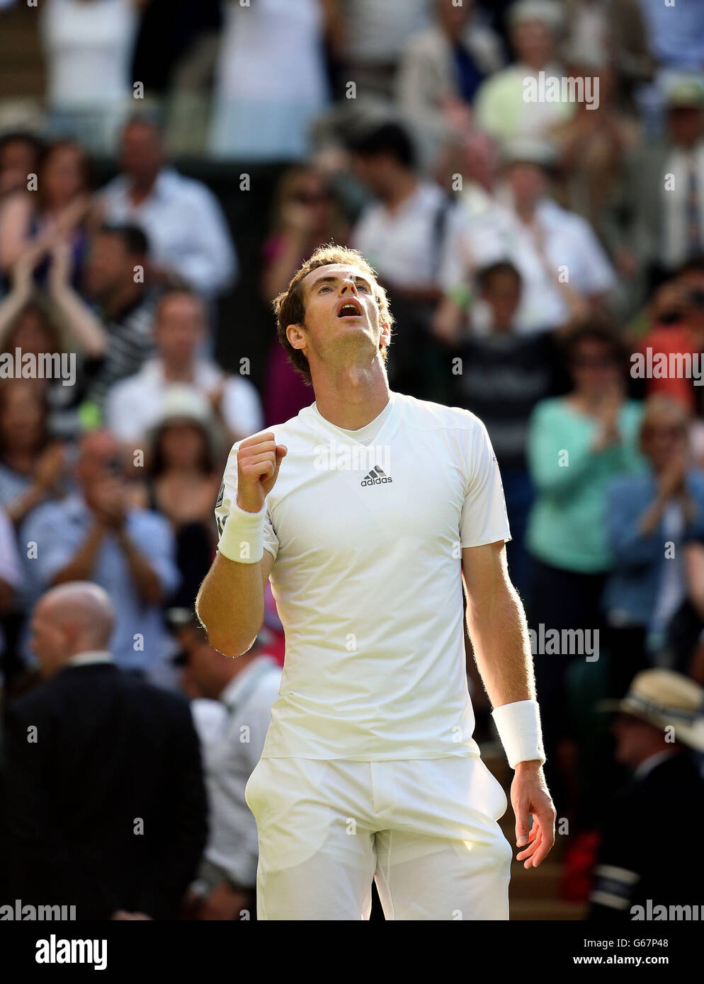 Great Britain's Andy Murray celebrates beating Russia's Mikhail Youzhny ...