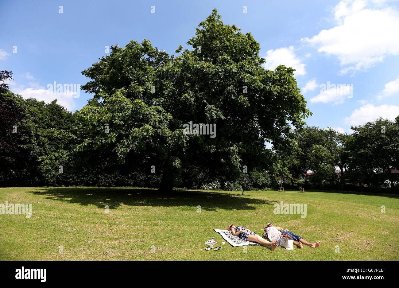 Charmaine and Steve Scutt from Brighton relax in the sun at Torkington ...