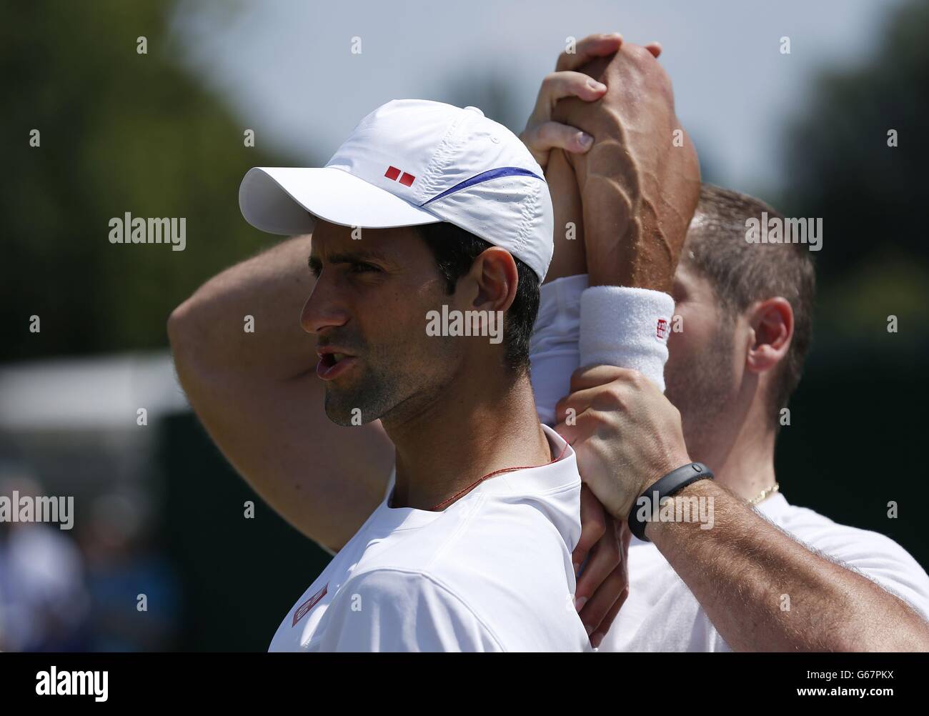 Serbia's Novak Djokovic stretches during a practice session on Court 5 ...