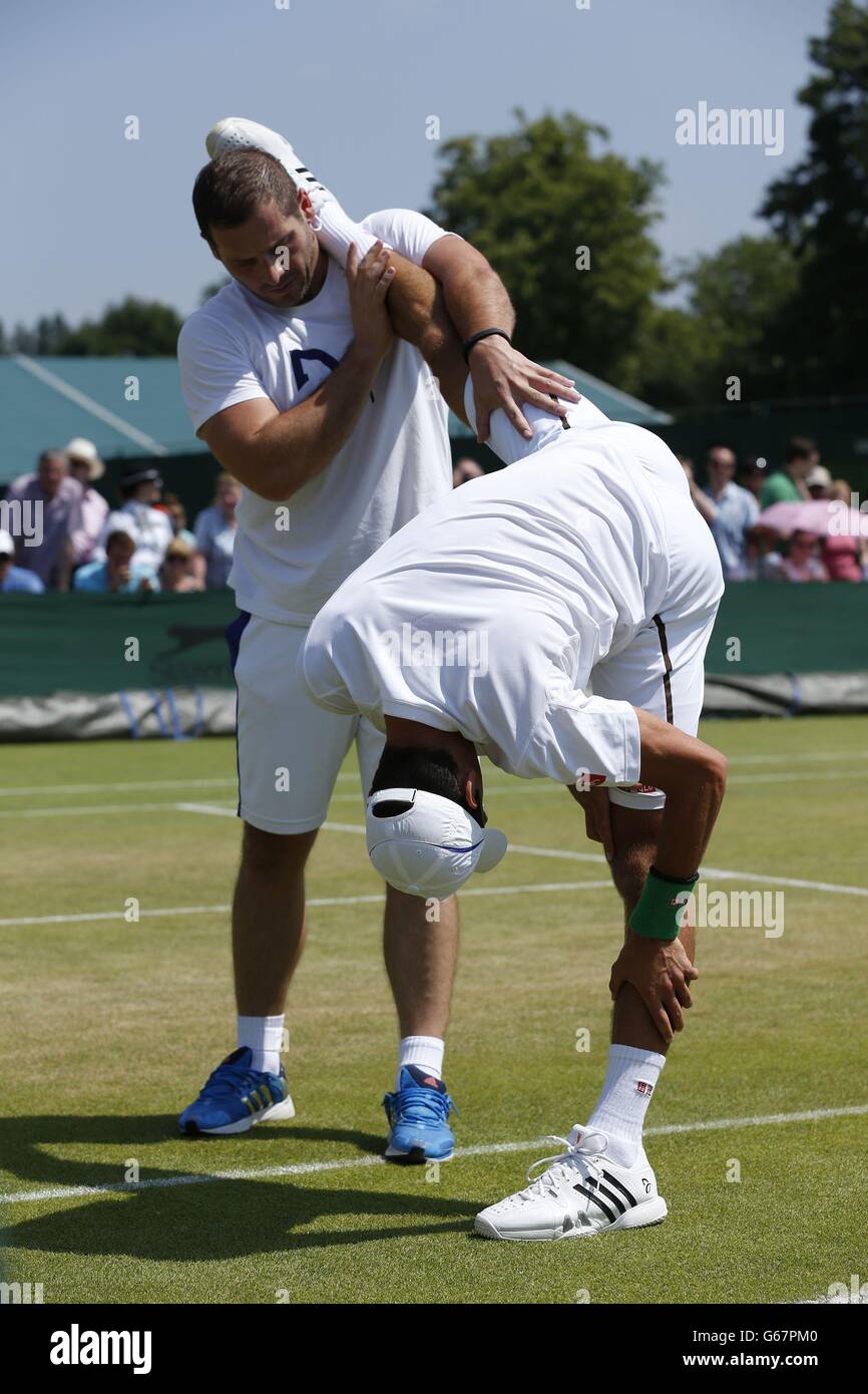 Serbia's Novak Djokovic stretches during a practice session on Court 5 ...