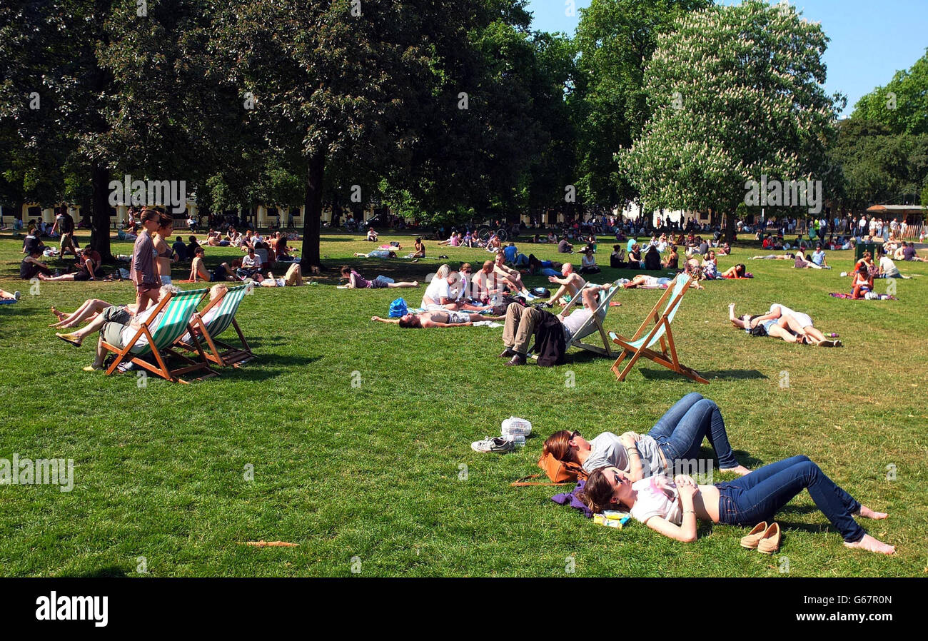 Sunbathers in St James Park, London, as much of Britain is bathed in ...
