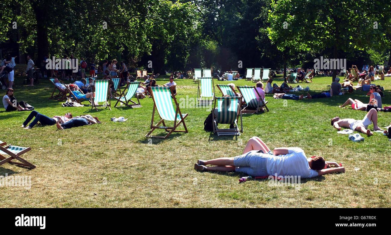 Sunbathers in St James Park, London, as much of Britain is bathed in ...