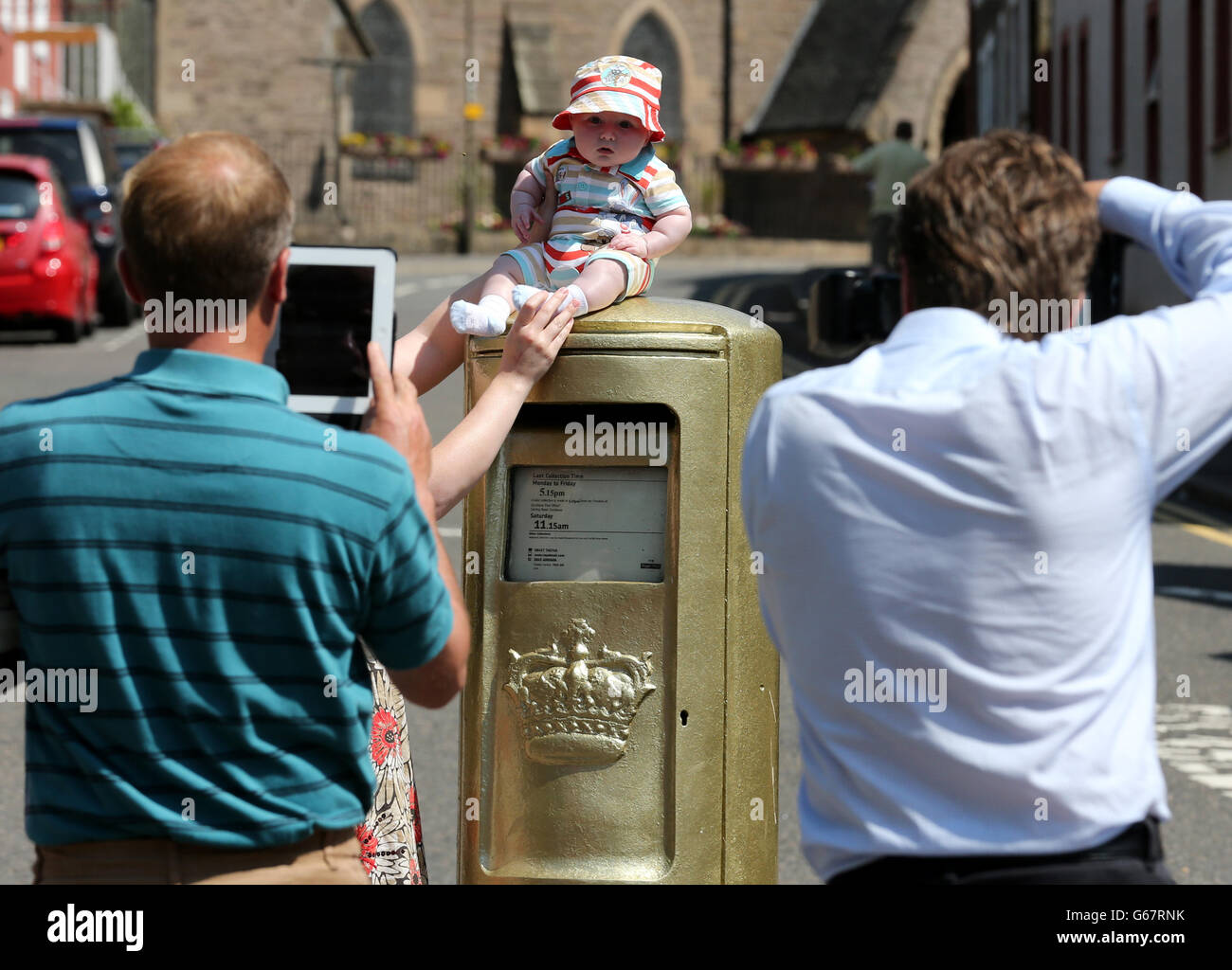 Three month old Evan Andrew Lupton has his picture taken on top of the ...