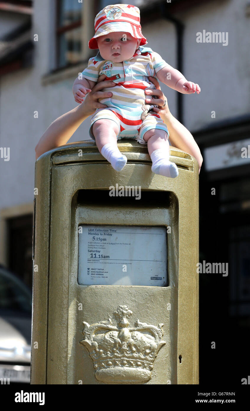 Three month old Evan Andrew Lupton has his picture taken on top of the ...