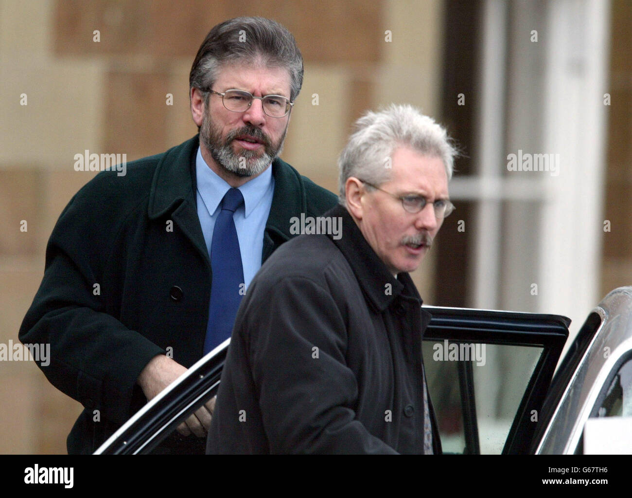 Sinn Fein President Gerry Adams (left) arrives with his press secretary ...
