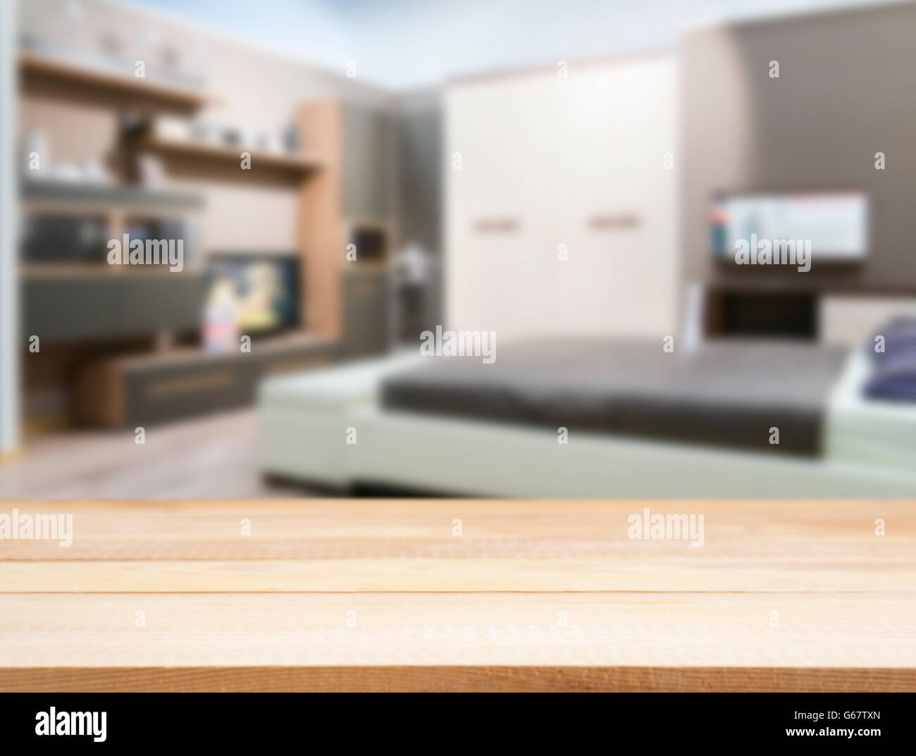 Wooden empty table in front of blurred bedroom Stock Photo - Alamy