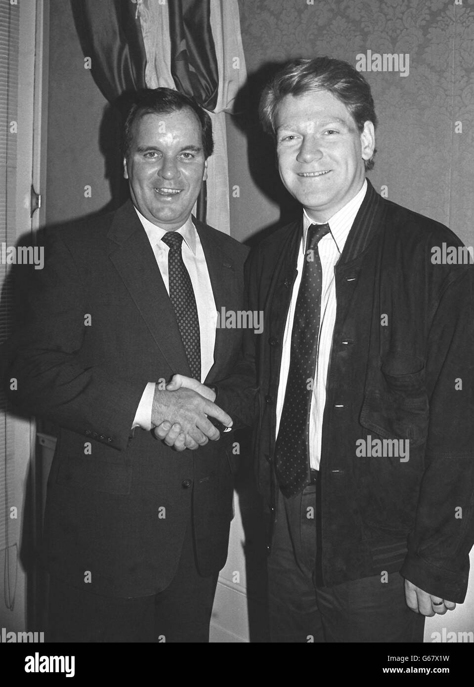 Black and white smiling shaking hands 3 4 length hi-res stock ...