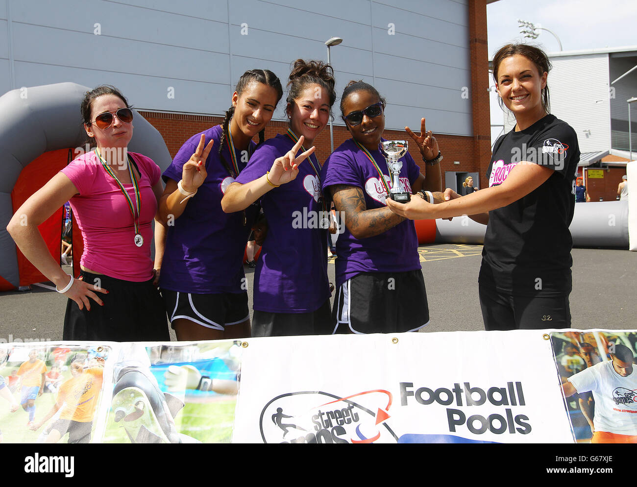 The runners up team are presented with their trophy at the end of the ...