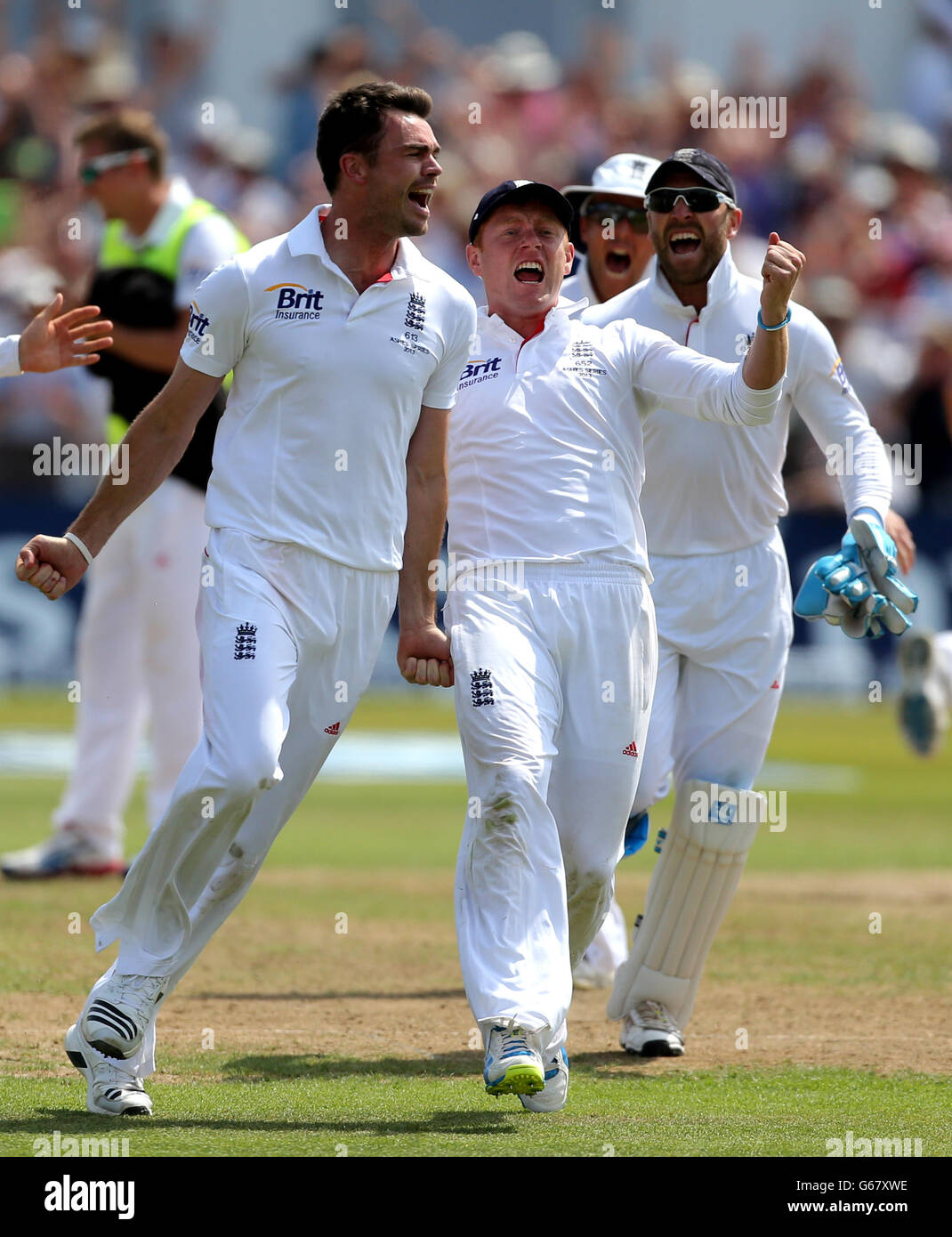 England bowler James Anderson (left) starts the celebrations as England ...