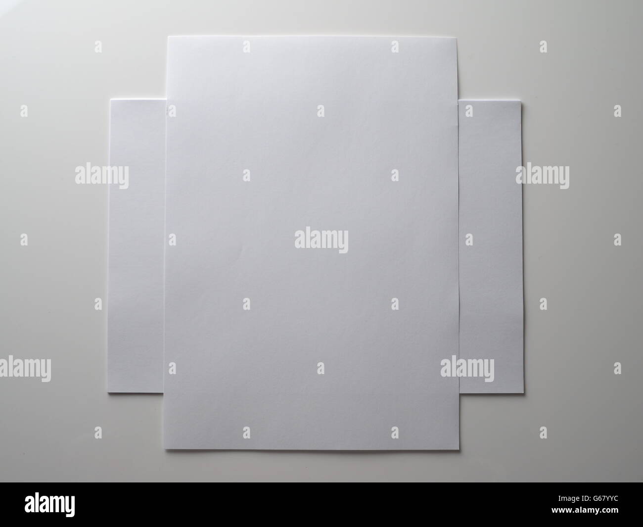 paper a4 on a grey background Stock Photo - Alamy