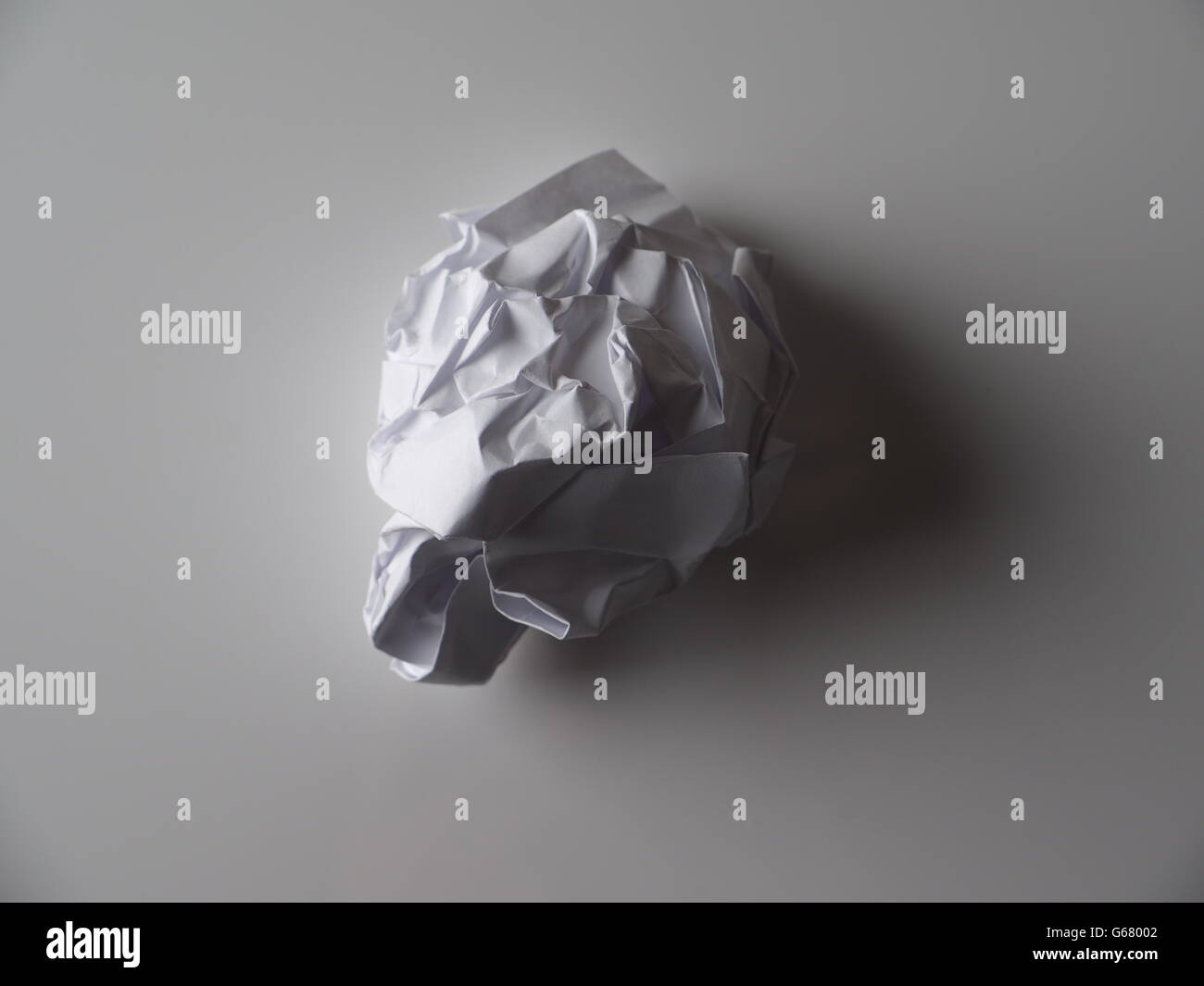 crumpled paper on a gray background Stock Photo - Alamy