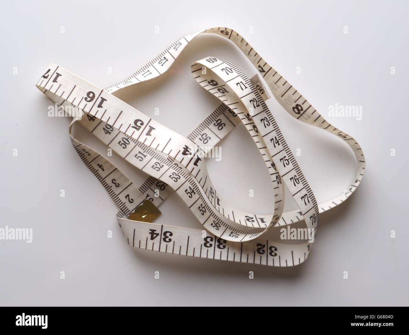 measuring tape on a gray background Stock Photo - Alamy