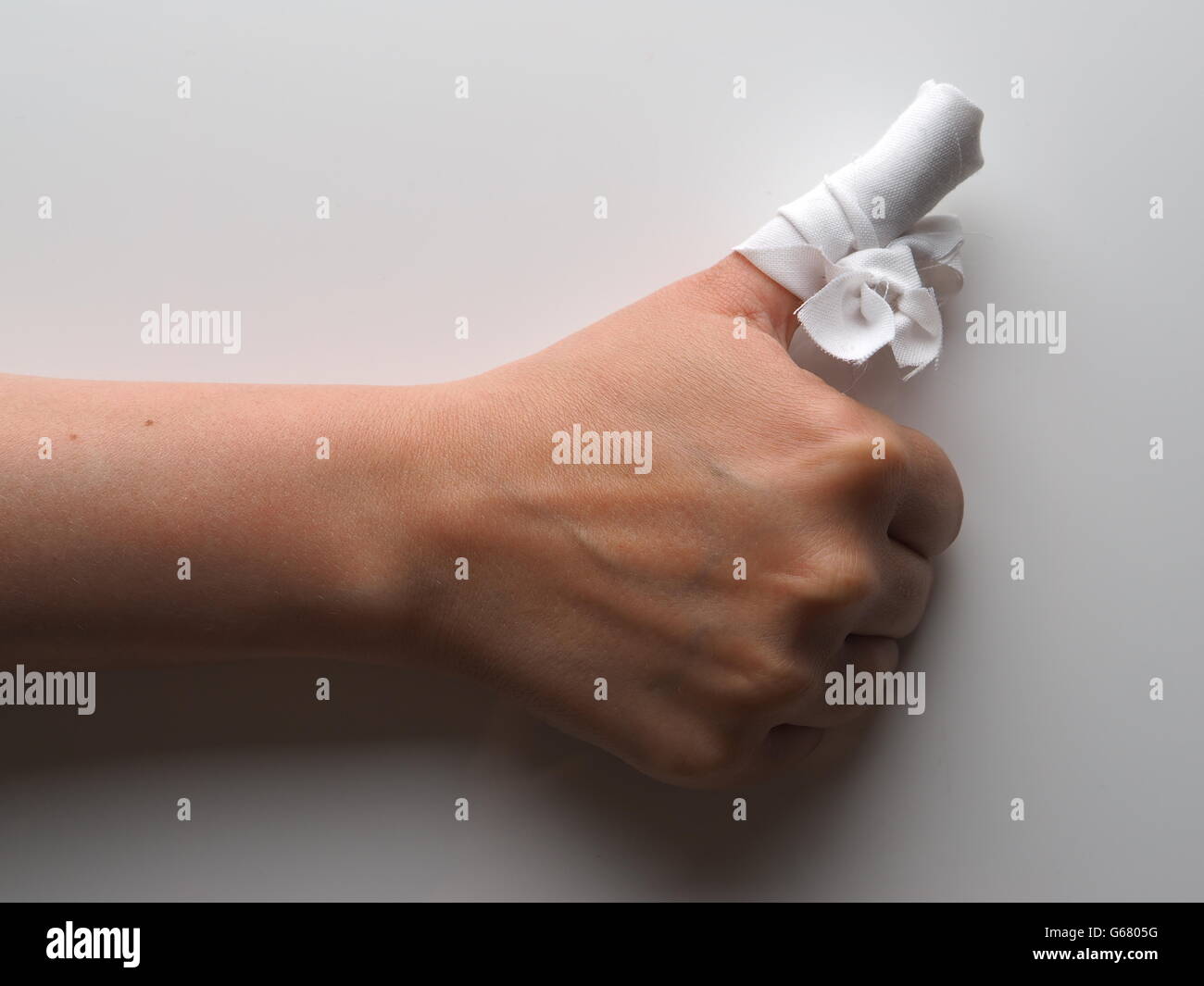 bandaged finger on a gray background Stock Photo - Alamy