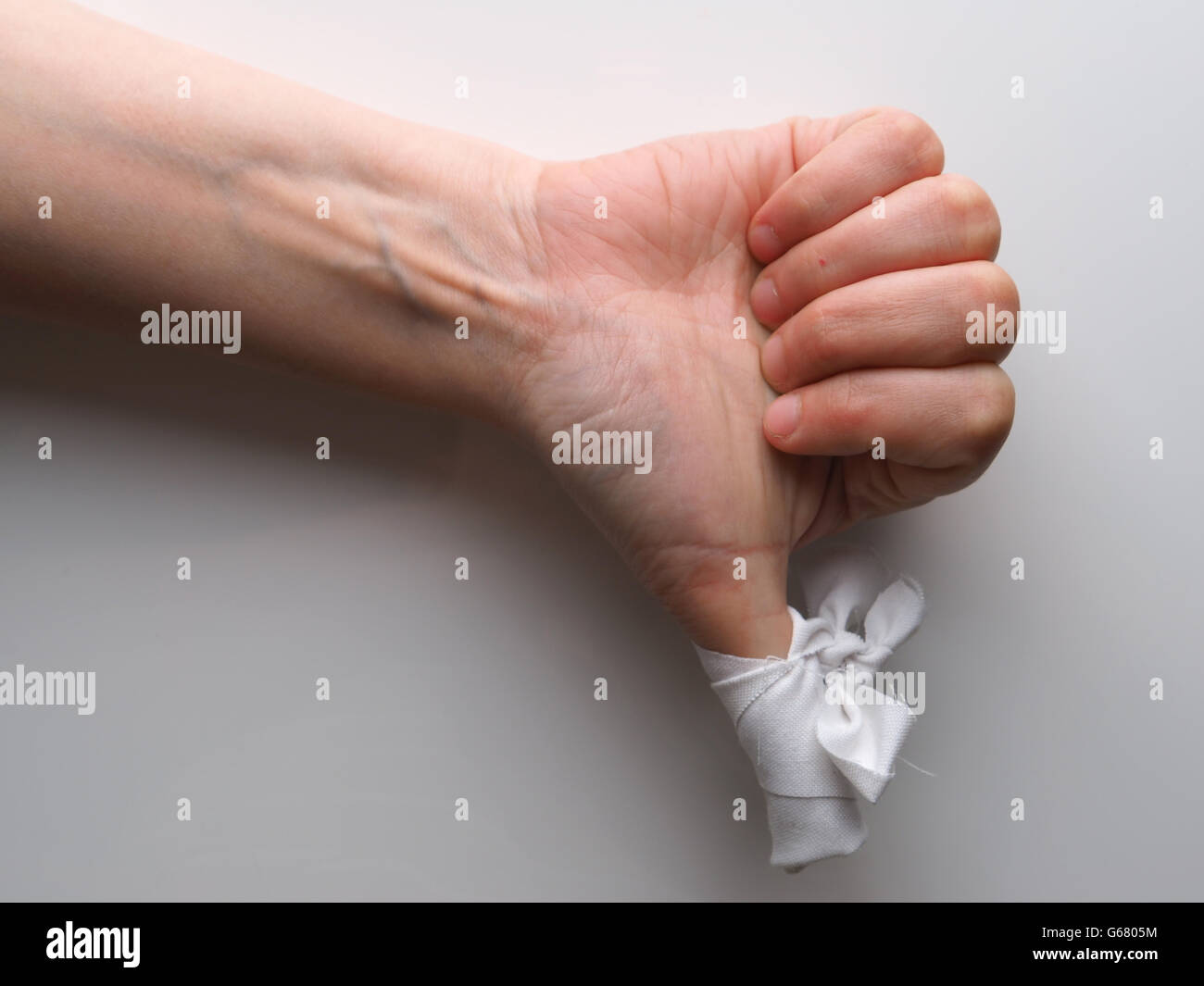 bandaged finger on a gray background Stock Photo - Alamy