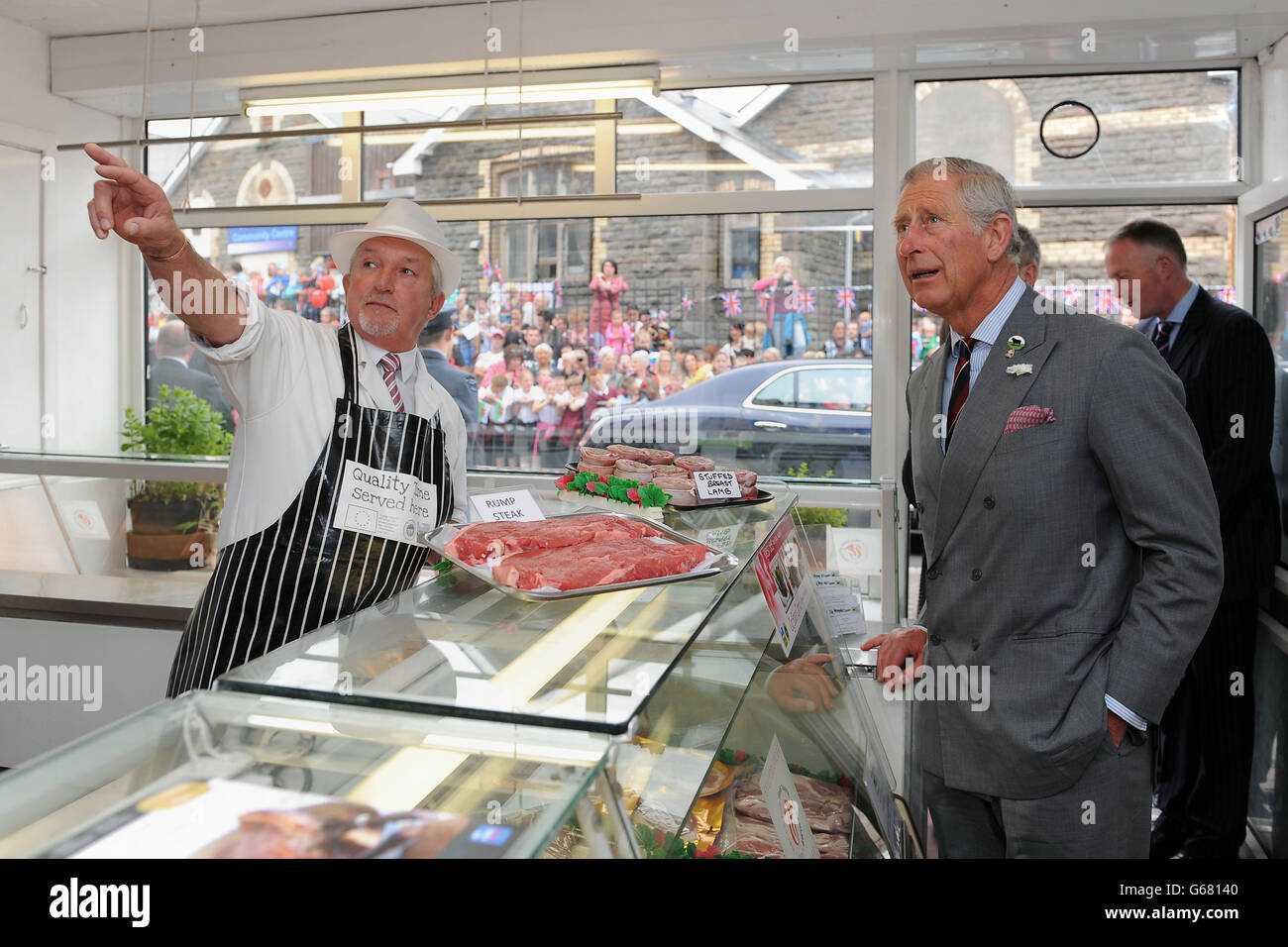 The Prince of Wales talks to butcher Steve Davais during a visit to the ...