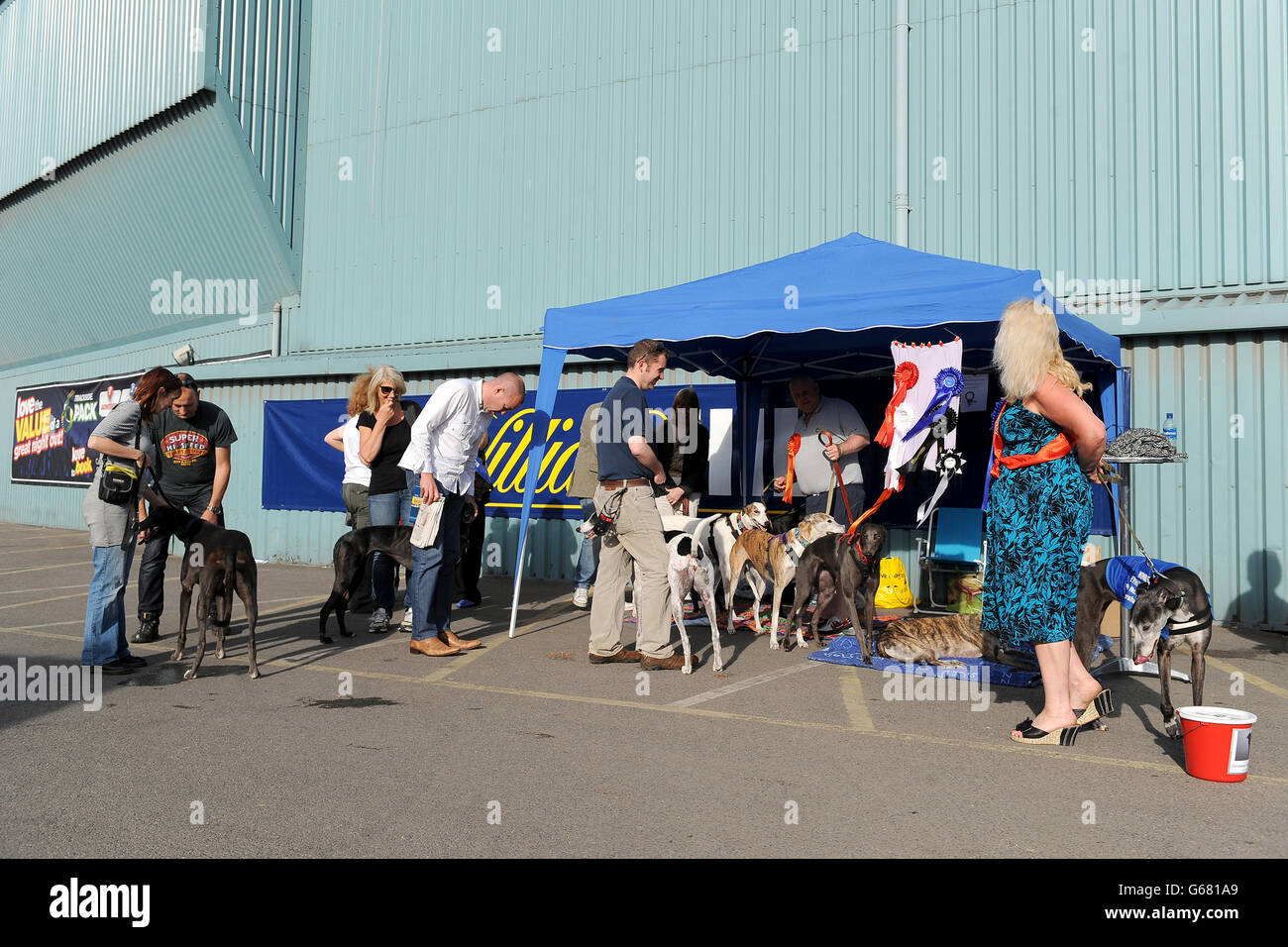 Spectators outside Wimbledon Stadium before the racing Stock Photo - Alamy