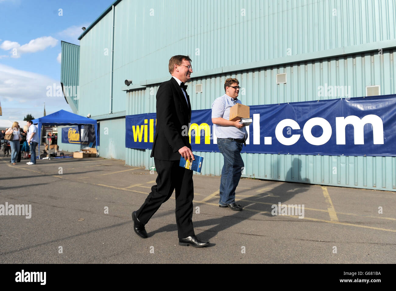 Spectators outside Wimbledon Stadium before the racing Stock Photo - Alamy