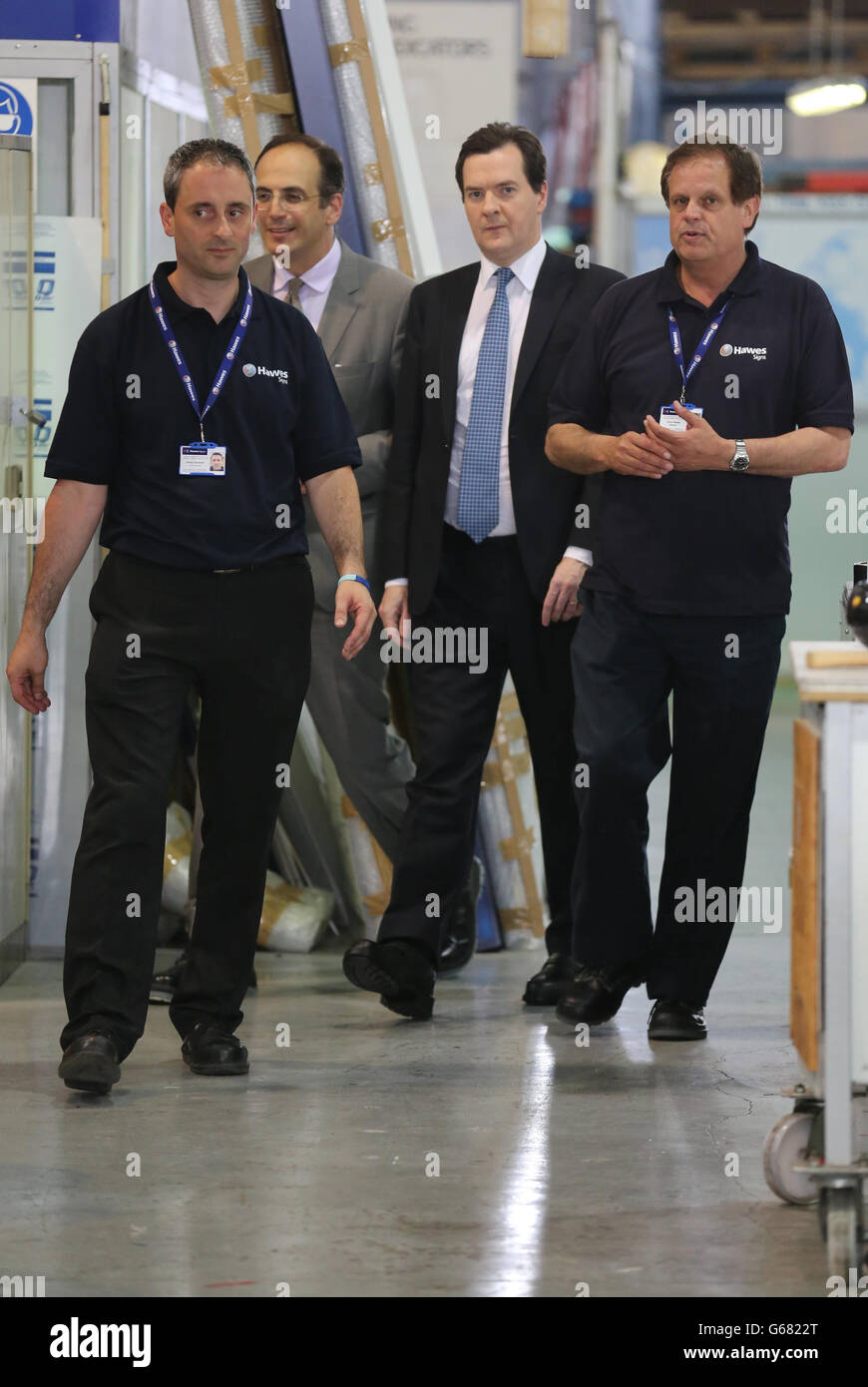 Chancellor George Osborne (2nd right), during a visit to Hawes Signs ...
