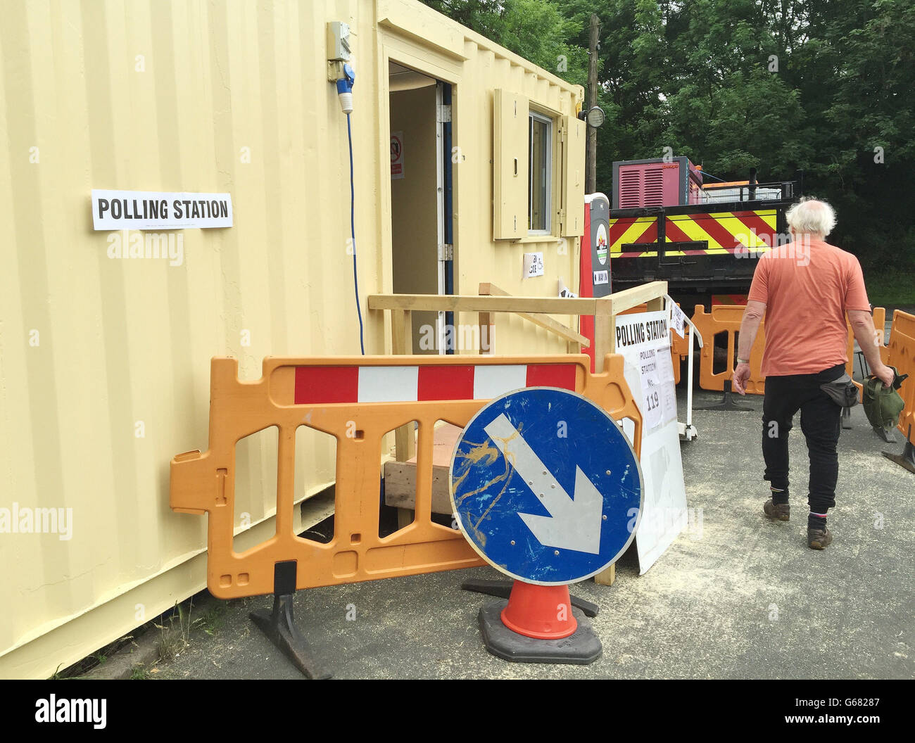 A man enters a polling station in a shipping container in Shelah Road ...