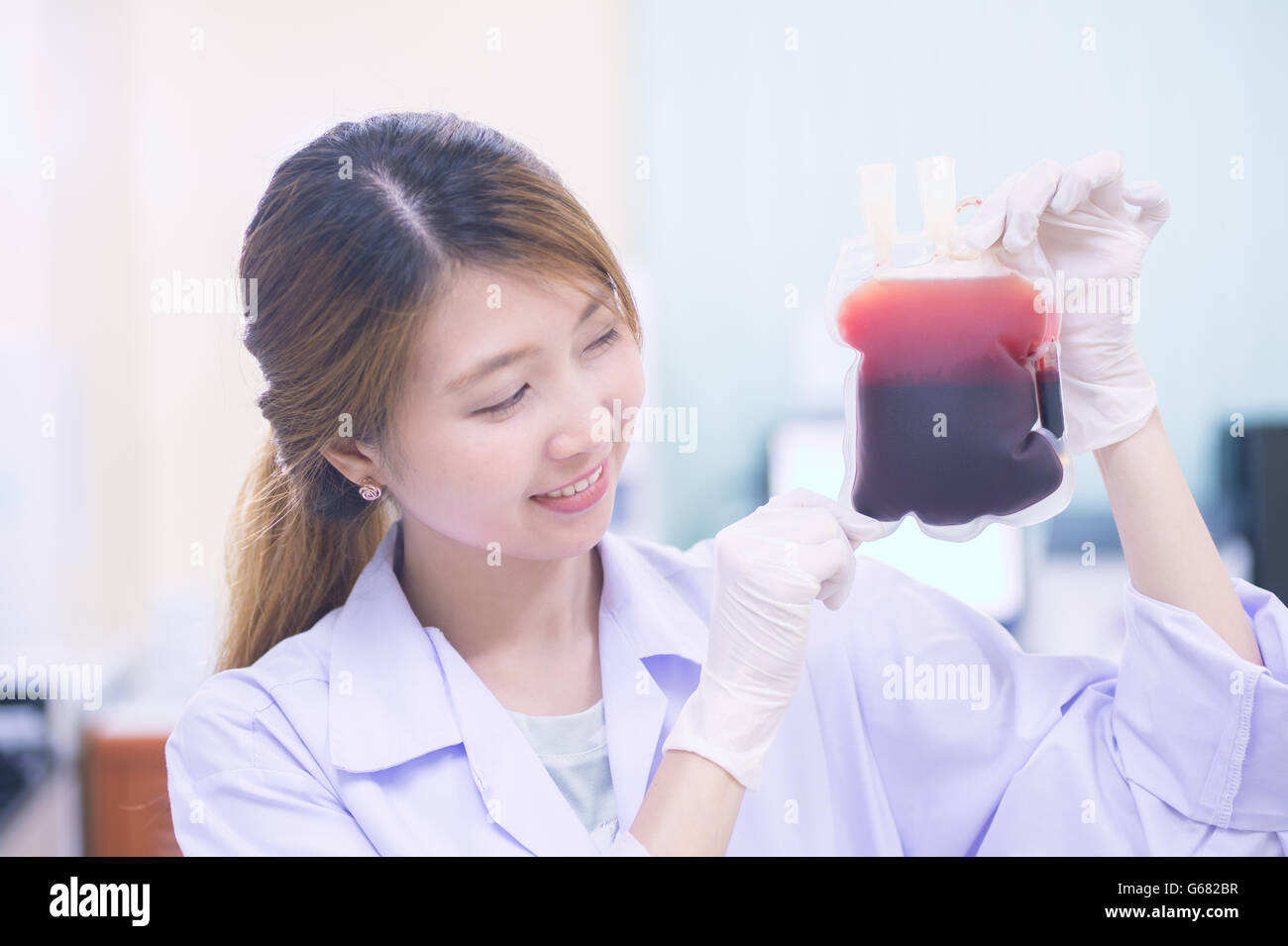 Bag of Blood in hand asian woman Doctor Stock Photo - Alamy