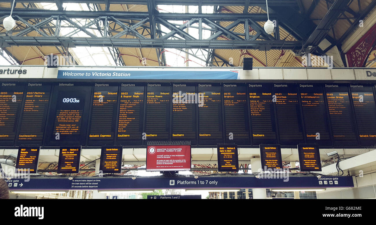 BEST QUALITY AVAILABLE Signs showing delayed trains at Victoria Station ...