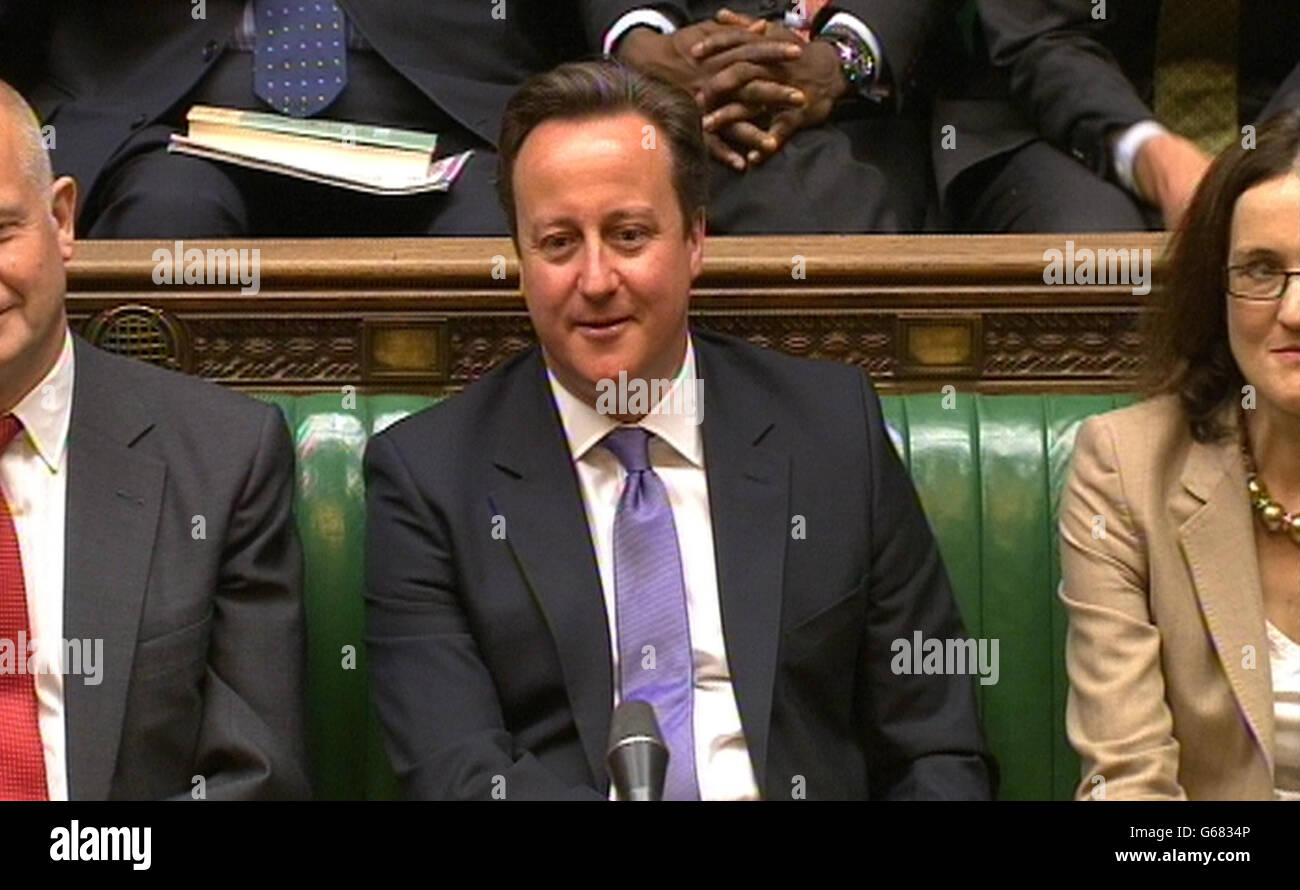 Prime Minister David Cameron listening to the debate in the House of ...