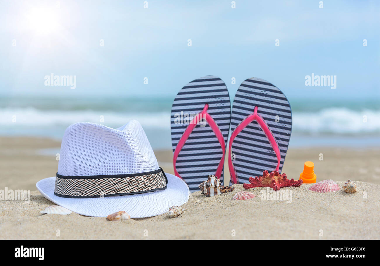 Flip-flops and shells on the beach. Summer Still Life Stock Photo - Alamy