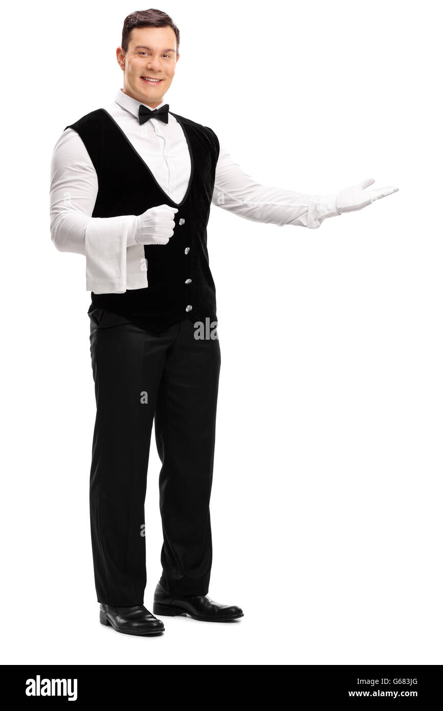 Full length portrait of a friendly waiter greeting someone isolated on ...