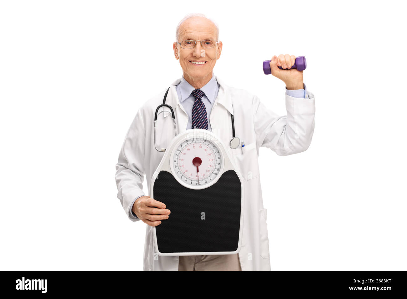 Mature doctor holding a weight scale and a dumbbell isolated on white ...