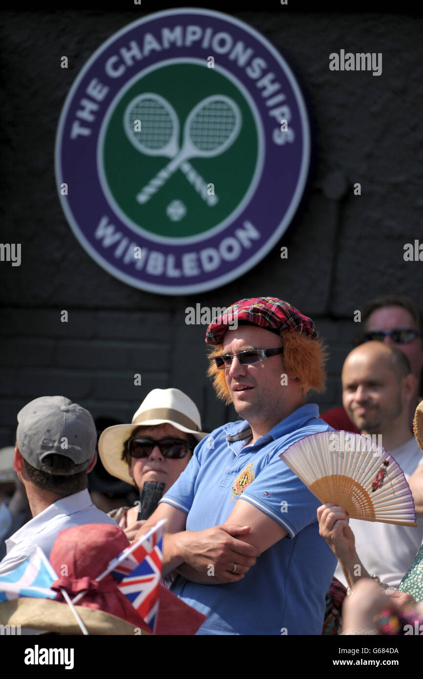 A spectator wearing a scottish cap and wig in the stands Stock Photo ...