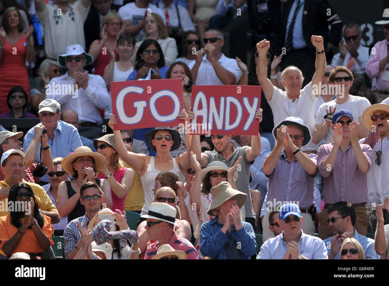 Crowds cheer on Great Britain's Andy Murray in the stands with signs ...
