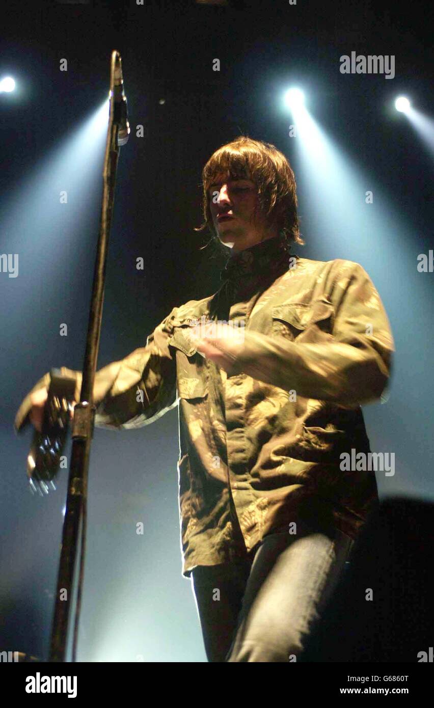 Oasis singer Liam Gallagher performing on stage at the Point Theatre ...