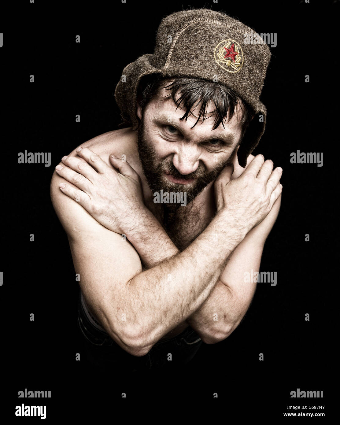 Dark portrait of scary evil sinister bearded man with smirk, makes ...