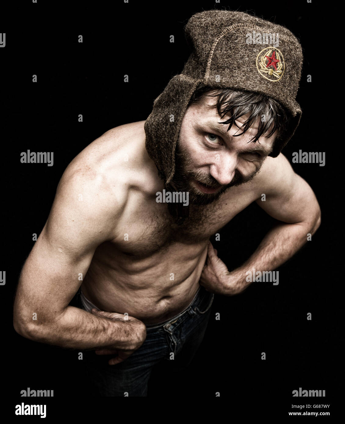 Dark portrait of scary evil sinister bearded man with smirk, makes ...