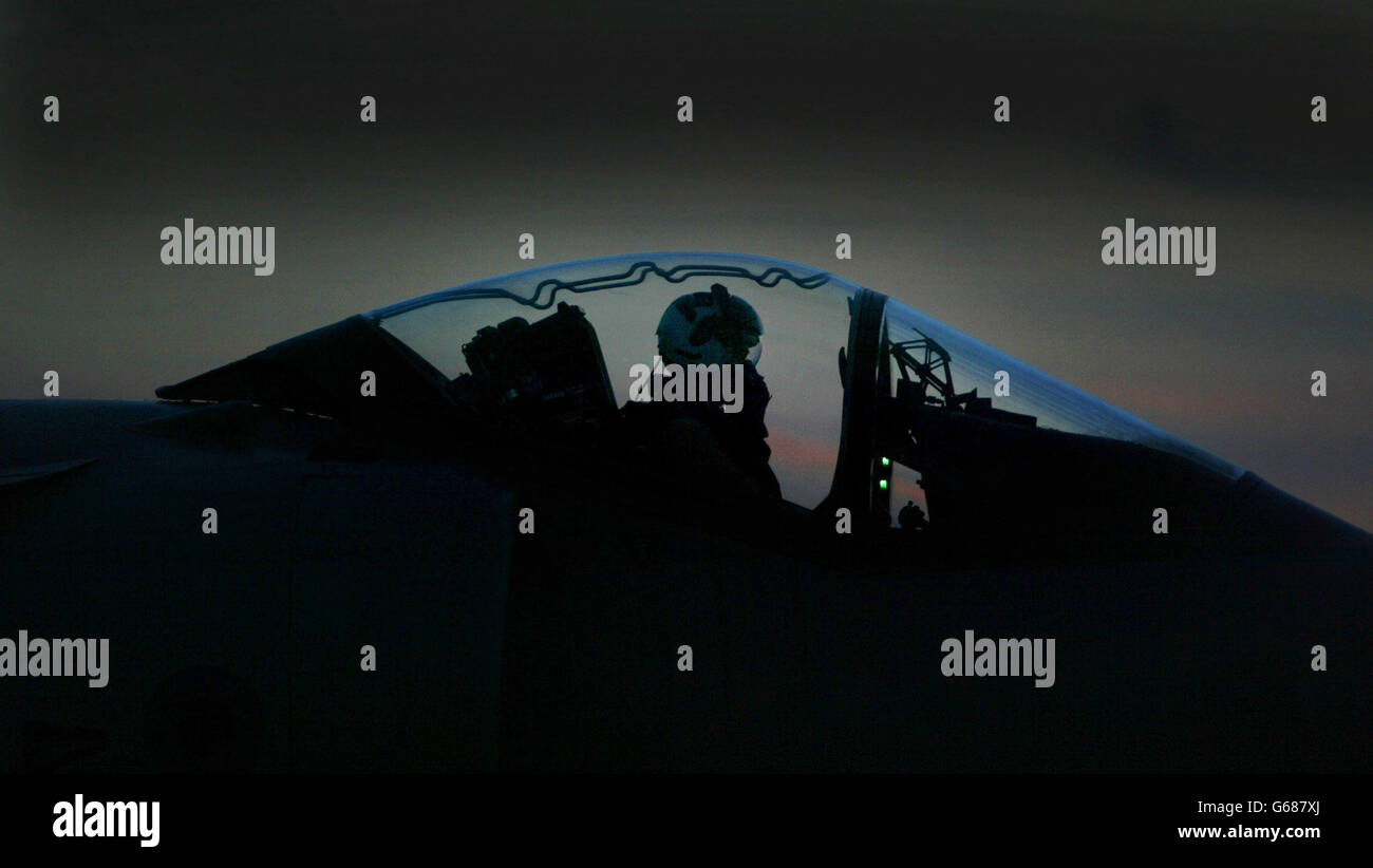 A Royal Air Force Harrier GR7 returns to base in the evening gloom in ...