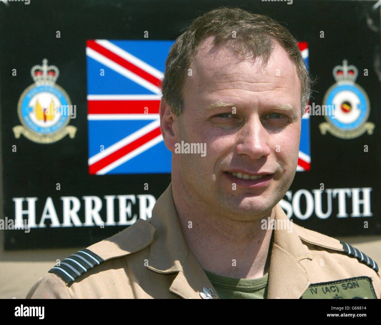 British Harrier G7 pilot Wing Commander Andy Suddards poses for a ...