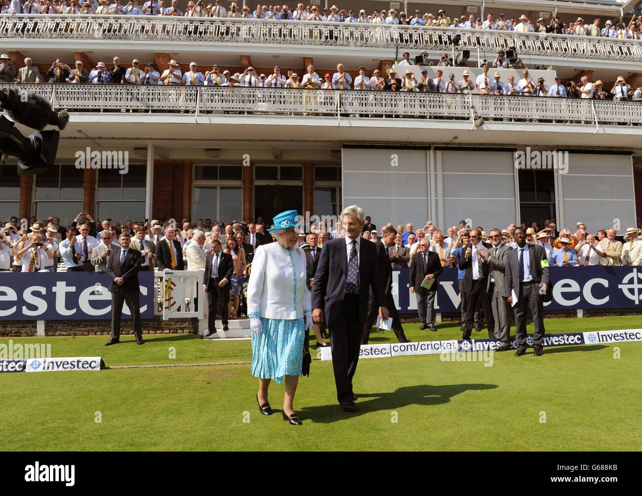 Queen Elizabeth II walks onto the field at Lord's Cricket Ground ...