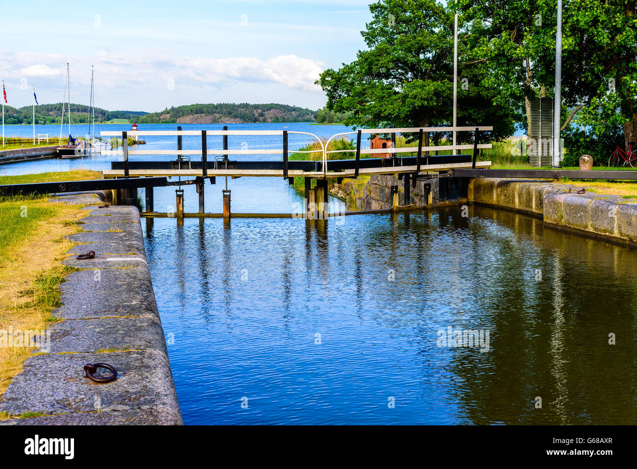Closed canal lock gate with the Baltic sea behind. Fine summer weather ...