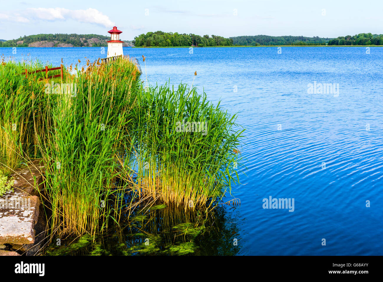 A very small lighthouse at the inlet of Gota canal in Mem, Sweden Stock ...