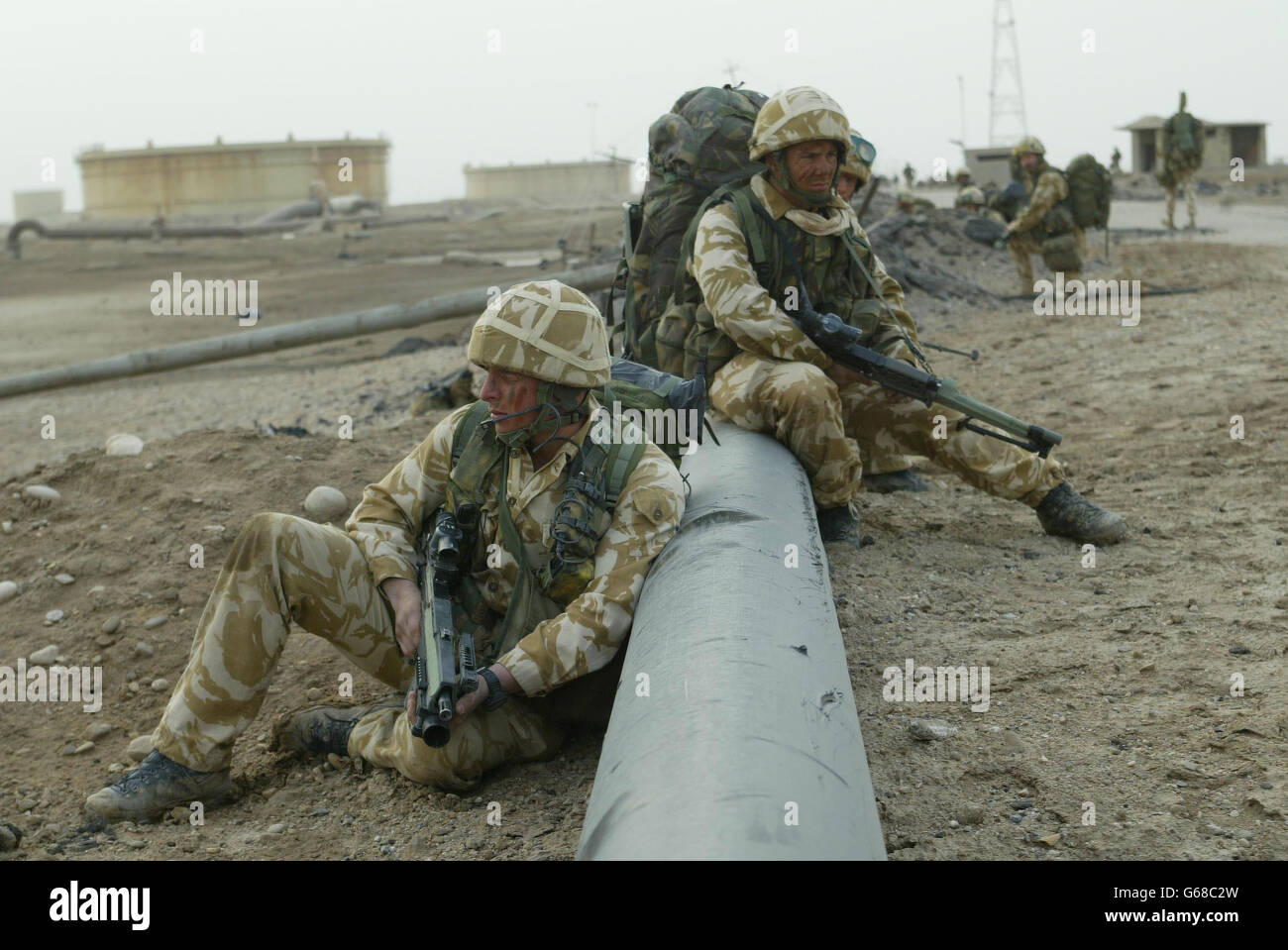 Members of 40 Commando, Royal Marines after taking the Alfaw Oil fields ...