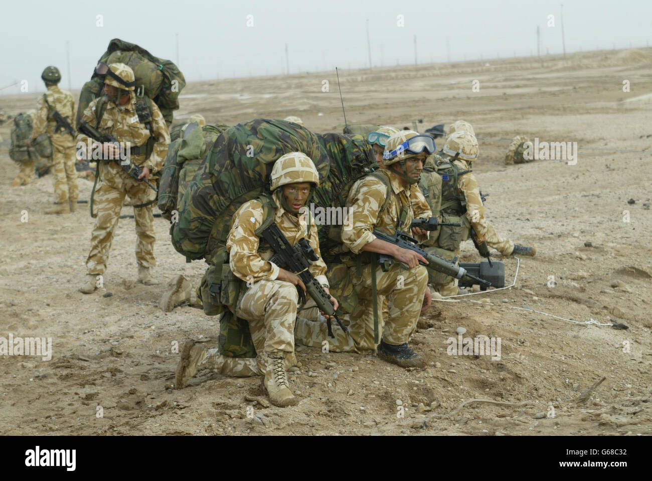 Members of 40 Commando, Royal Marines after taking the Alfaw Oil fields ...