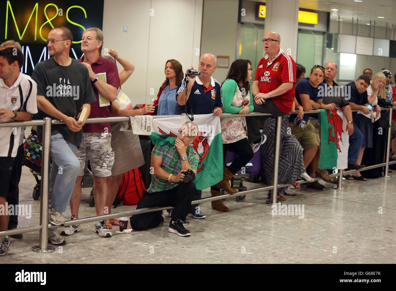 Fans wait to greet the British and Irish Lions, upon their arrival at ...