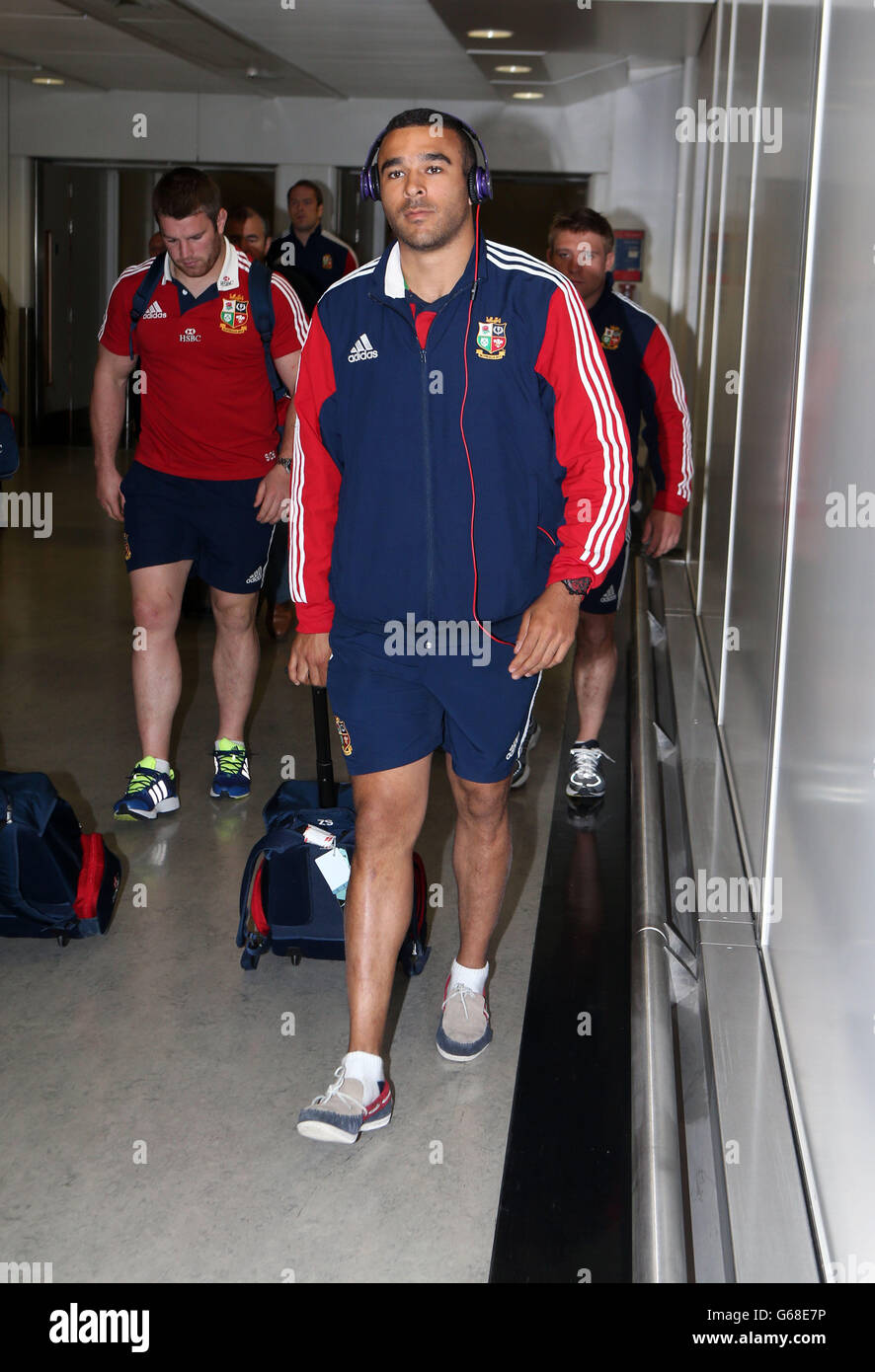 Simon Zebo (right) of the British and Irish Lions, arrives at Heathrow ...